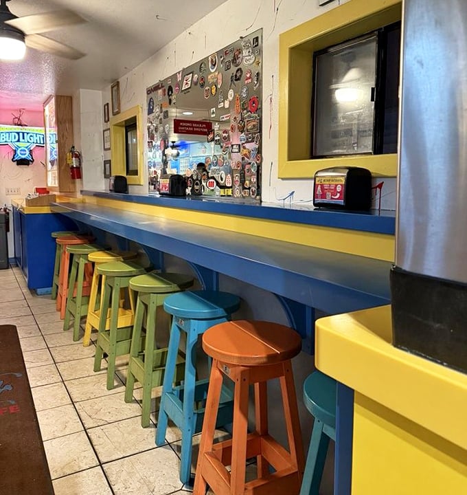 The colorful bar stools aren't just seating &ndash; they're front-row tickets to the seafood show. Choose your hue, choose your view.