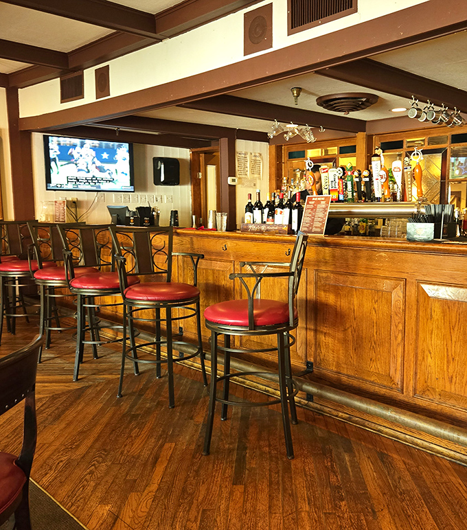 The full bar setup means you can enjoy a proper cocktail while watching your dinner being prepared behind the counter.