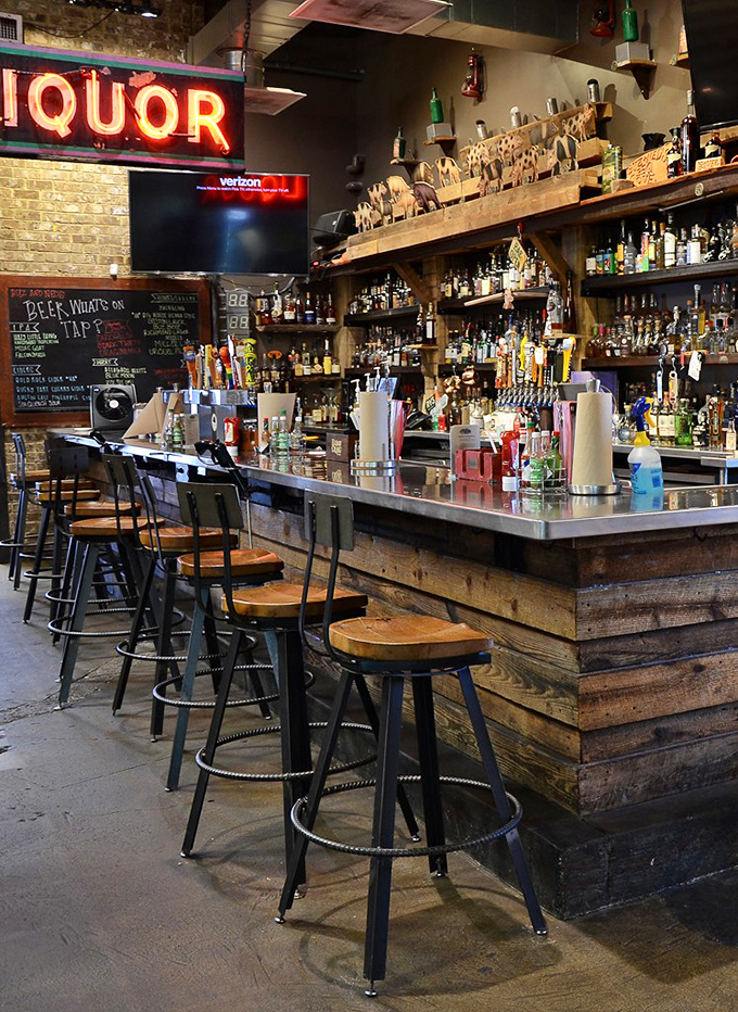 Rustic bar seating with exposed brick invites you to settle in, order another round, and contemplate life's smoky mysteries.