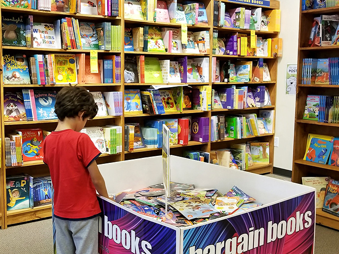 Young minds discover the joy of bargain books, proving some of life's best treasures still come without charging ports or screens.