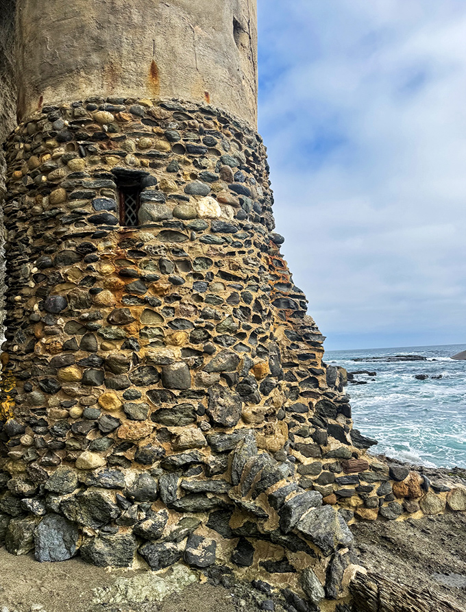 The tower's stone base tells a story of craftsmanship – each rock carefully selected and placed to withstand decades of ocean's fury.