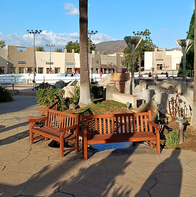 Strategic bench placement: the unsung hero of successful outlet shopping expeditions and relationship-saving rest stops.