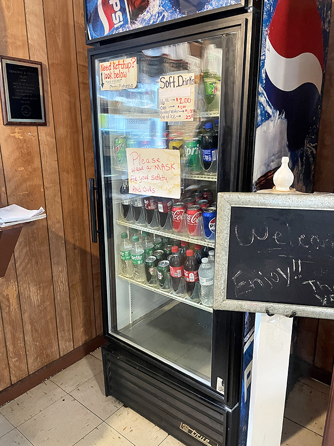 The beverage cooler stands ready like a trusty sidekick, offering sweet relief from the smoky, savory main event ahead.