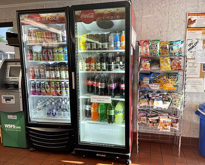 The beverage coolers glow like treasure chests, promising the perfect pairing for whatever delicious decision you've just made.