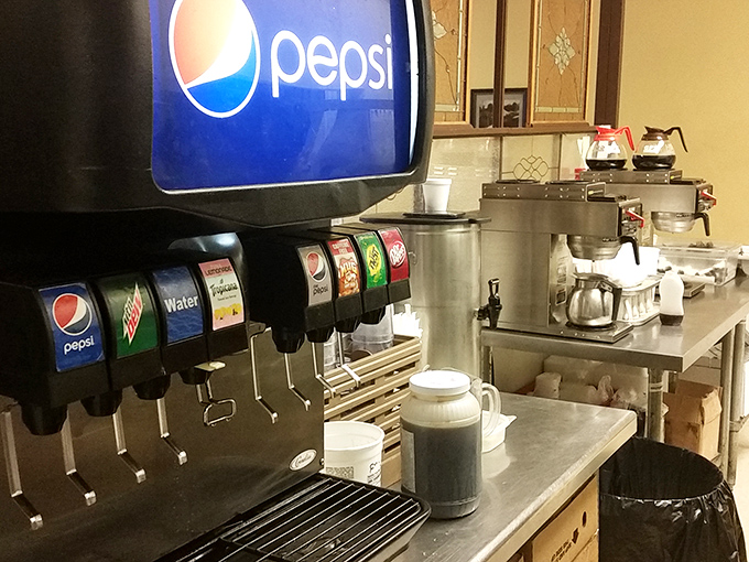 The humble beverage station&mdash;where coffee is always brewing and the soda machine stands ready to fulfill its fizzy promises without judgment.