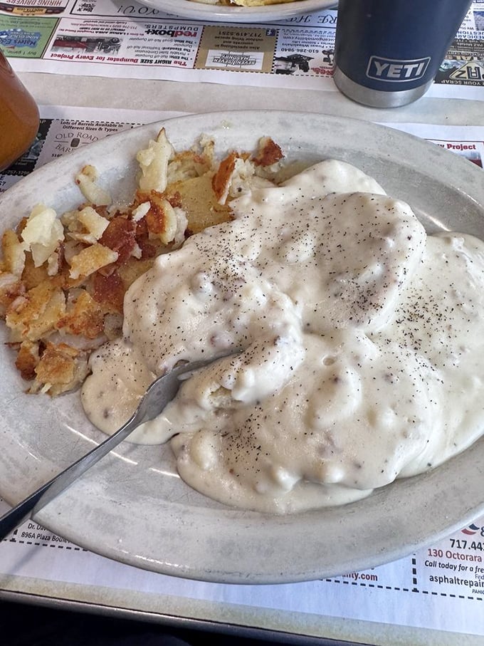 Biscuits and gravy: the breakfast that hugs you from the inside. Creamy, peppery gravy blankets everything in comfort food bliss.