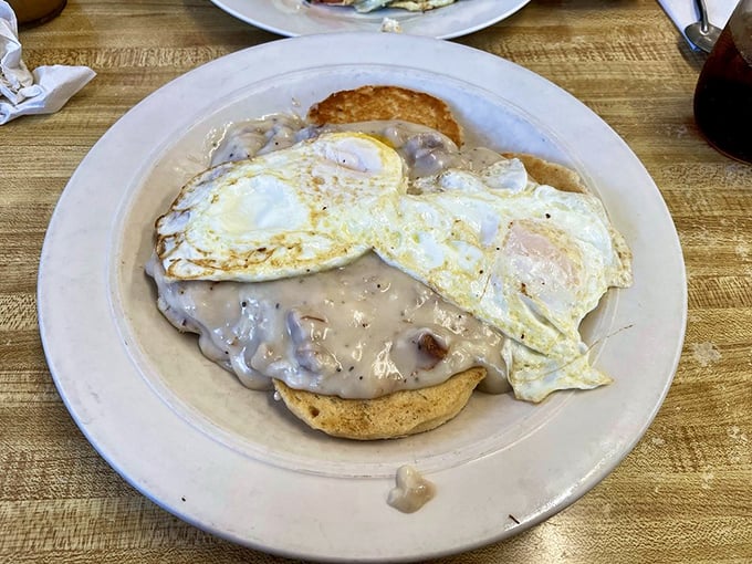 Biscuits swimming in creamy gravy with sunny-side-up eggs &ndash; Southern comfort food that somehow found its perfect home in a Massachusetts diner.