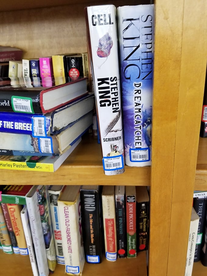 Stephen King neighbors other literary giants on these wooden shelves &ndash; bestsellers patiently waiting for their next reading adventure.
