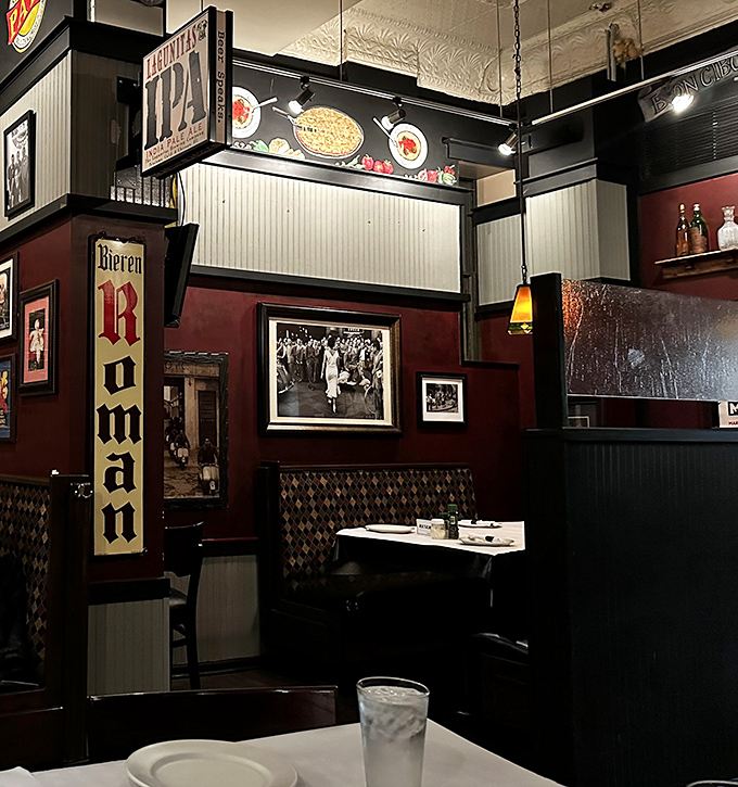 The corner booth with its vintage signage offers that perfect blend of privacy and people-watching that makes neighborhood restaurants feel like home.