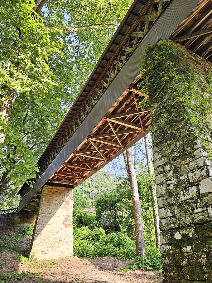 Looking up reveals the bridge's architectural underbelly&mdash;a geometric masterpiece that would make your high school math teacher finally proud of you.
