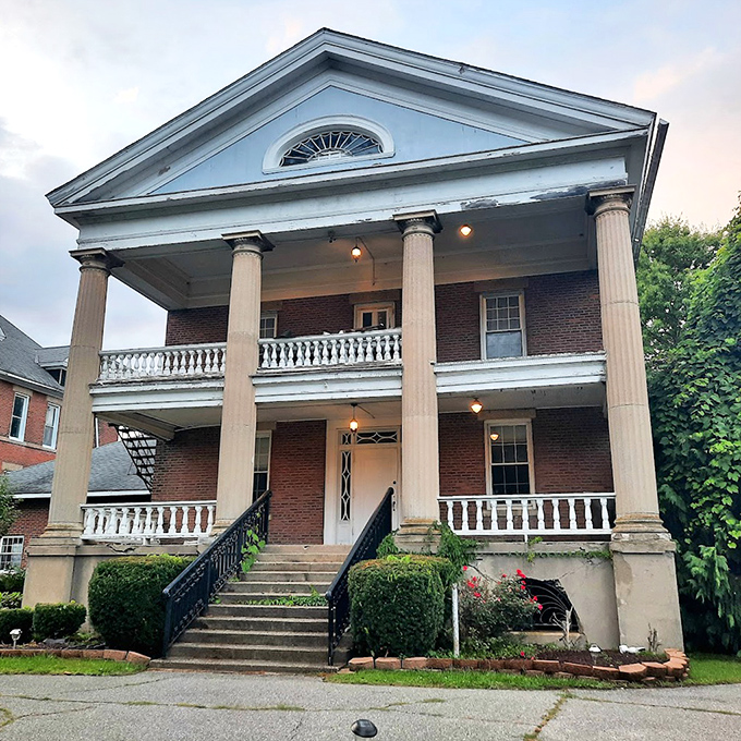 The evening light casts a golden glow on the portico, transforming the seminary into something almost welcoming&hellip; almost.