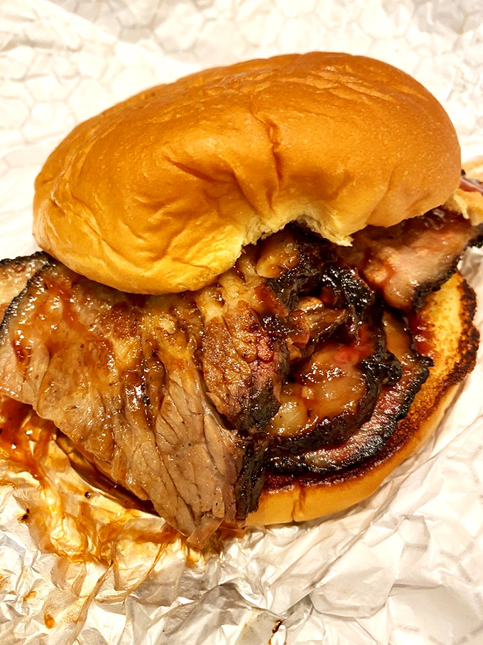 Brisket so tender it practically surrenders to the bun. The kind of sandwich that makes you want to hug the pitmaster.