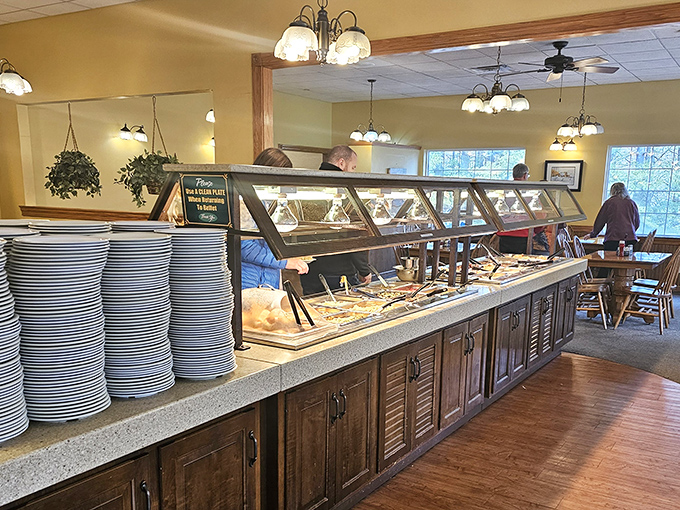 The buffet line&mdash;where dreams are made and diets go to die, with stacks of plates standing by like willing accomplices.