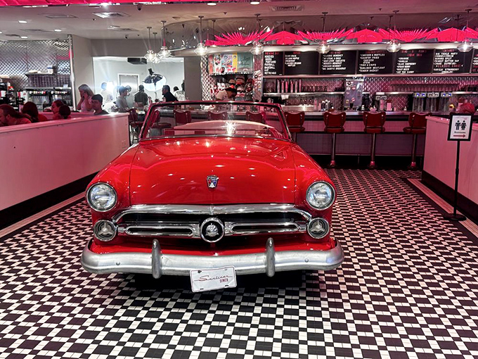 Detroit meets dining in this showstopping vintage car booth. Forget drive-through – this is "drive-in" taken to delicious new heights.