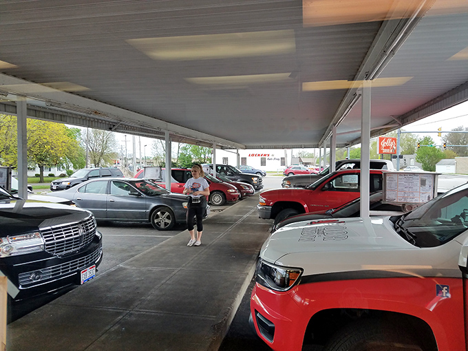 The covered parking area harkens back to when "fast food" meant someone actually bringing food to your car window.