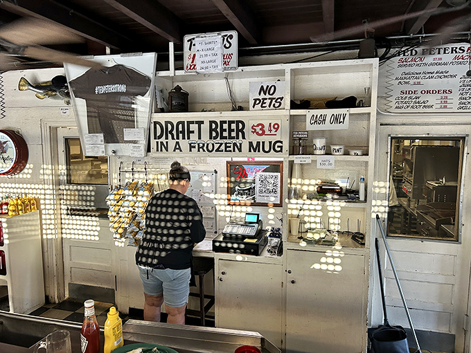 The ordering counter: where dreams come true, cash is king, and "Draft Beer in a Frozen Mug" is the eleven-word poem that speaks to your soul.