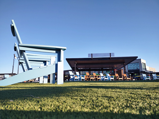Oversized Adirondack chairs invite weary shoppers to rest their feet and contemplate their next retail conquest.