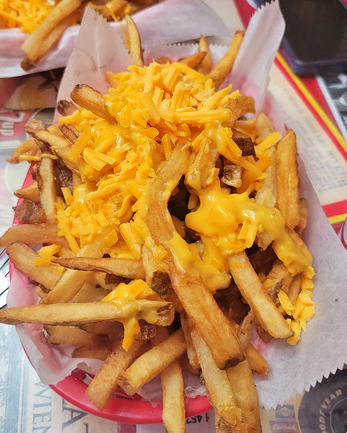 Cheese fries that make you want to write poetry&mdash;golden, hand-cut potatoes embraced by a blanket of melted cheddar that stretches with each bite.