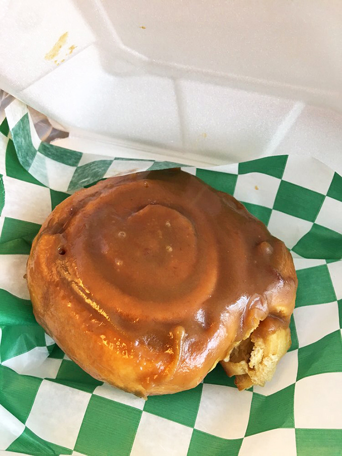A cinnamon roll that doesn't know the meaning of moderation &ndash; gloriously oversized, perfectly glazed, and worth every sticky finger.