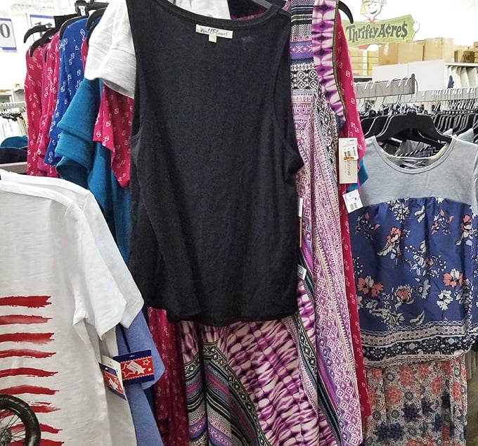 Clothing racks overflow with possibilities &ndash; it's like your closet's future is hanging right there, begging for adoption.