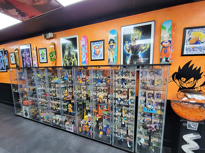 Display cases packed with Dragon Ball treasures line the orange walls. This isn't just a restaurant; it's a shrine to anime fandom with food to match.
