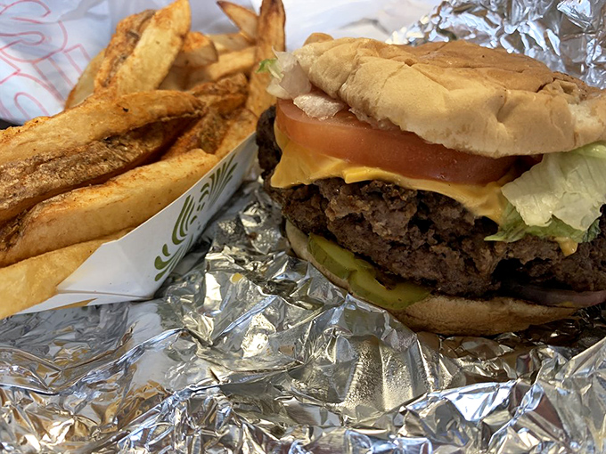 The holy trinity of comfort food – burger, fries, and a cold drink. Some traditions don't need improving, just respecting.