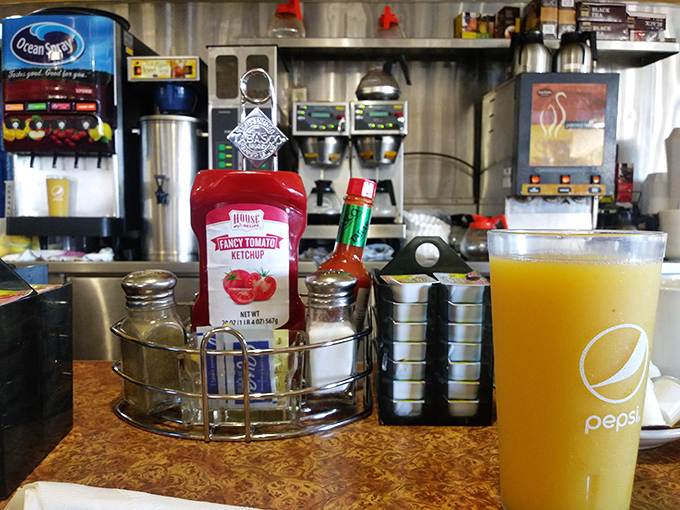 Table-side condiments and creamers within easy reach, because getting up to find hot sauce interrupts the sacred breakfast experience unnecessarily here.