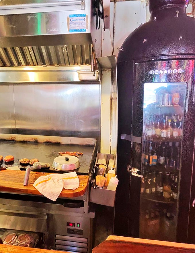 Behind the scenes magic where burgers are born. The flat-top grill has probably seen more action than a Hollywood stunt double.