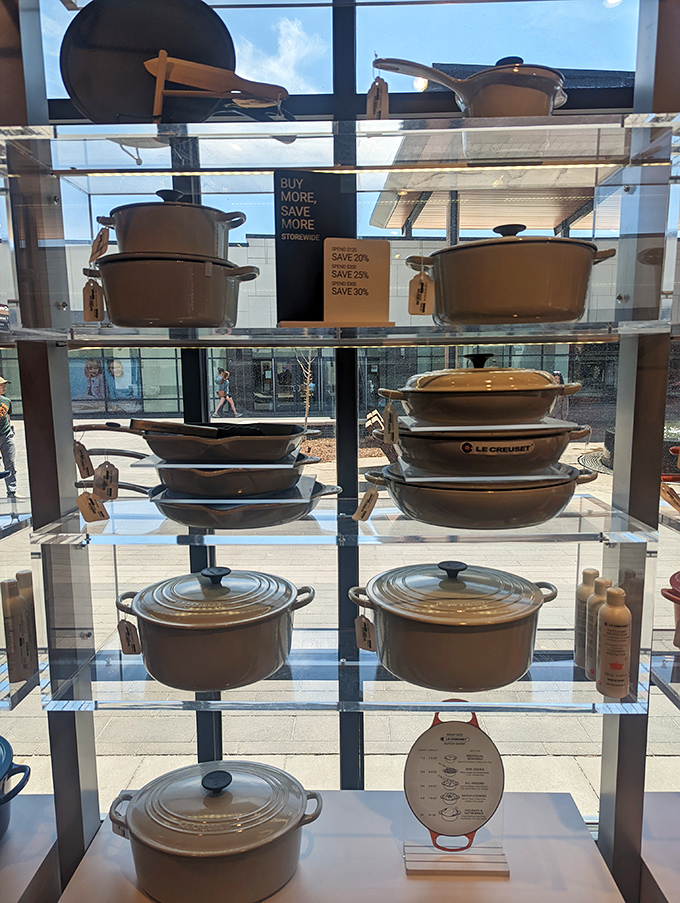 Le Creuset's iconic cookware, displayed like jewels behind glass. Kitchen dreams that won't require a second mortgage to fulfill.