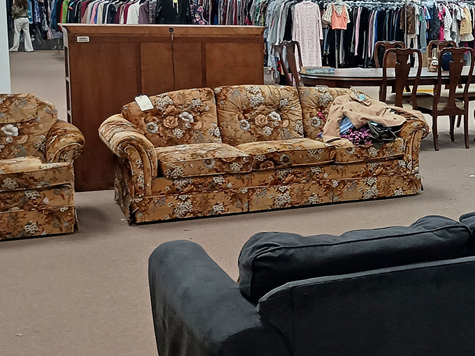 That floral couch has seen some things, ready to anchor your den with serious vintage vibes.