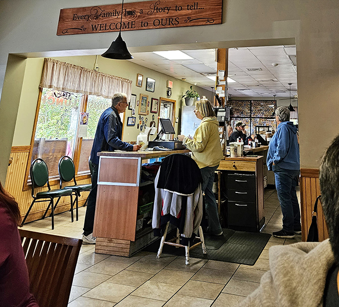 Where everybody knows your name &ndash; or will by your second visit. The welcoming counter at Country Diner, where breakfast dreams come true beneath that charming wooden sign.