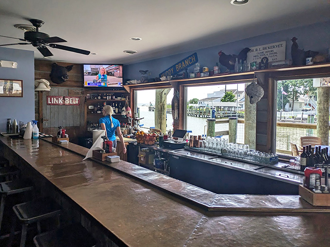 The bar area serves up drinks with a view, because watching boats while sipping something cold is basically therapy.
