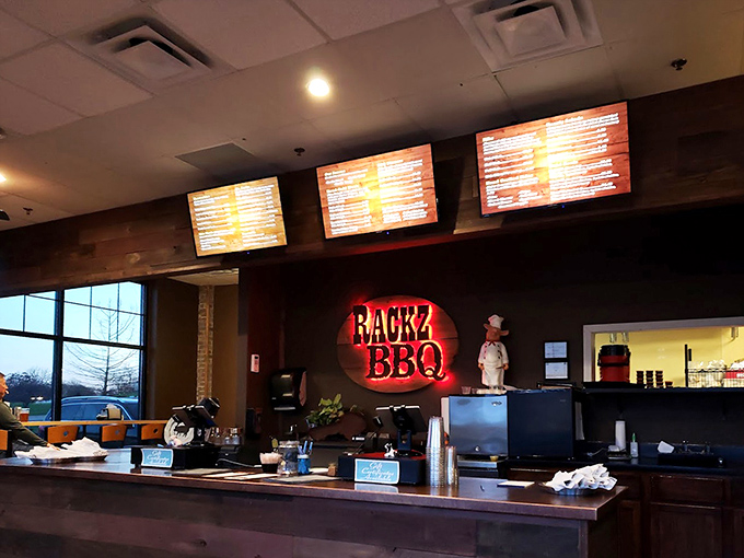 The counter where barbecue dreams come true. That illuminated sign isn't just decoration—it's a beacon of hope for the hungry.