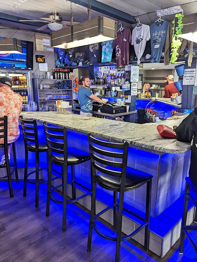 The bar glows blue like a Great Lakes sunset, inviting you to pull up a stool and share your best fish tale.