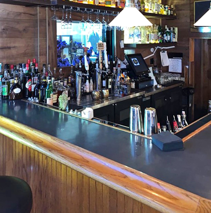 This isn't just a bar counter&mdash;it's the front row to culinary theater where classic cocktails are born and dinner plans are hatched over perfectly chilled martinis.