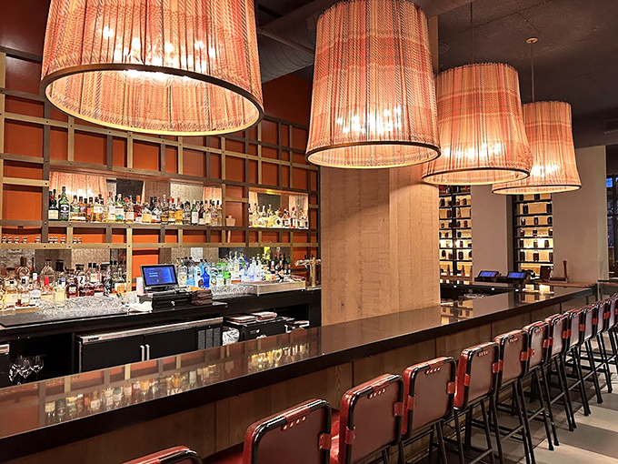 A bar that understands the gravity of a proper cocktail. Those pendant lights set the mood for serious sipping decisions.