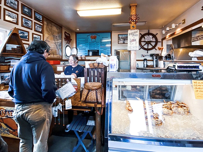 Where the magic happens. The compact counter space serves as command central for seafood dreams, with nautical touches reinforcing the harbor-to-plate ethos.