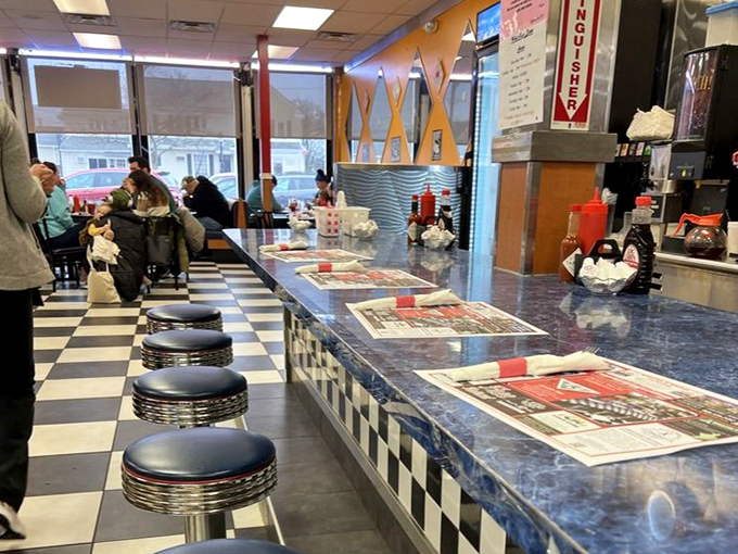 The wall serves as both decoration and mission statement&mdash;this is a place that takes its breakfast seriously, with vintage signs to prove it.