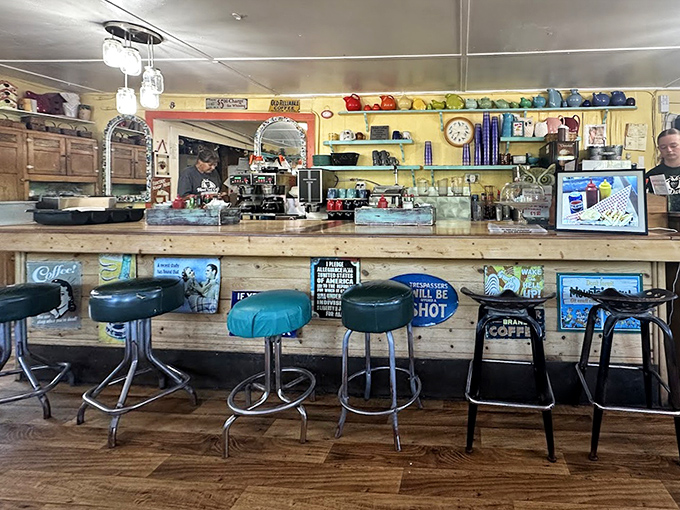 The counter seating offers front-row tickets to the breakfast show, complete with coffee refills that appear like magic.