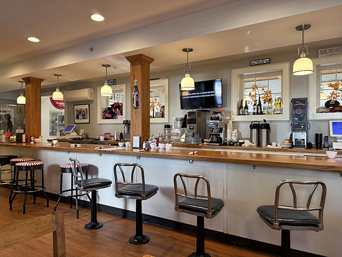 The counter where regulars perch like Vermont royalty, watching the morning ballet of coffee pours and order calls.