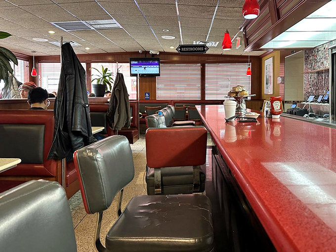 The counter seating&mdash;where solo diners become part of the diner family and the coffee refills come with a side of local wisdom.