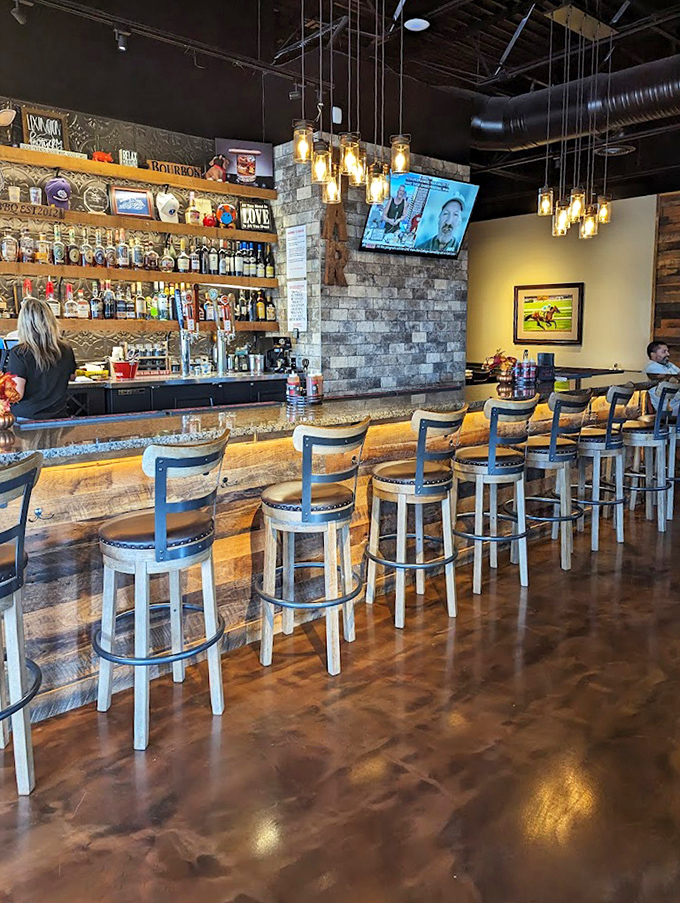 A bar that says "Kentucky" without shouting it. Those pendant lights create the perfect glow for bourbon contemplation.