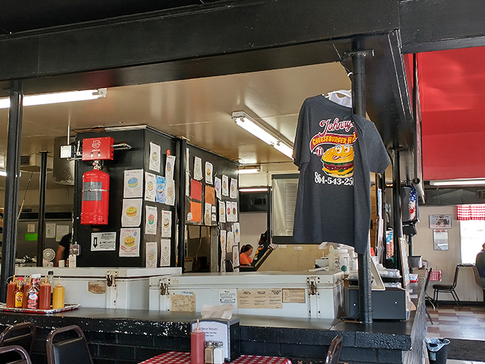 The beating heart of the operation&mdash;where orders are called, tickets are hung, and burger magic happens behind the counter.