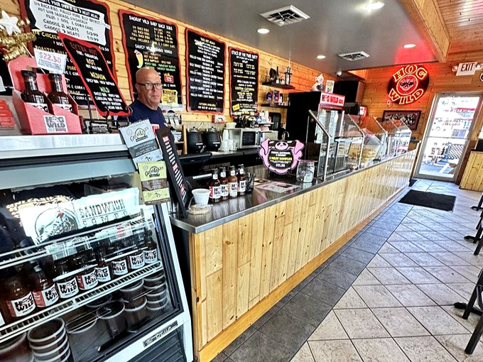 At the counter, where barbecue dreams become reality, the wood-paneled command center orchestrates a symphony of smoke and satisfaction.