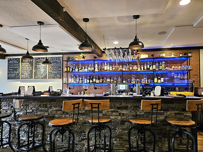 The bar area glows with blue light and promise&mdash;like a beacon for those seeking liquid courage before committing to a 16-ounce ribeye. 
