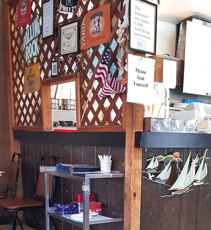 The lattice wall displays a proud collection of beer signs and maritime memorabilia&mdash;visual proof you're in a place that takes seafood seriously, not itself.