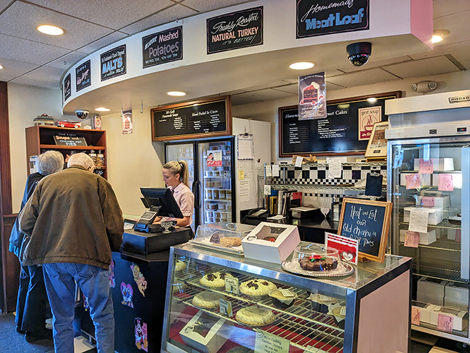 The dessert counter&mdash;where willpower goes to die. That sign might as well read "Abandon diet, all ye who enter here."