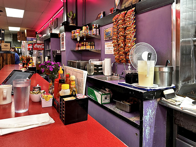 Behind every great diner is a counter that's seen it all. The chips hanging like flavor trophies are just part of the charm.