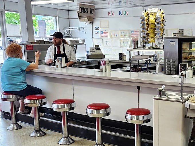 The counter stretches invitingly, chrome stools ready for anyone seeking breakfast, lunch, or just good old-fashioned diner camaraderie and sustenance.