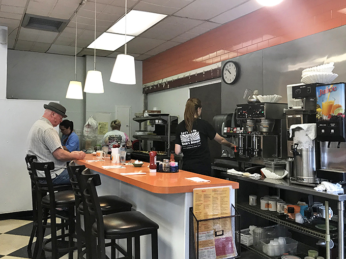 The counter&mdash;where solo diners find community, coffee cups are never empty, and the staff performs the daily ballet of breakfast service.